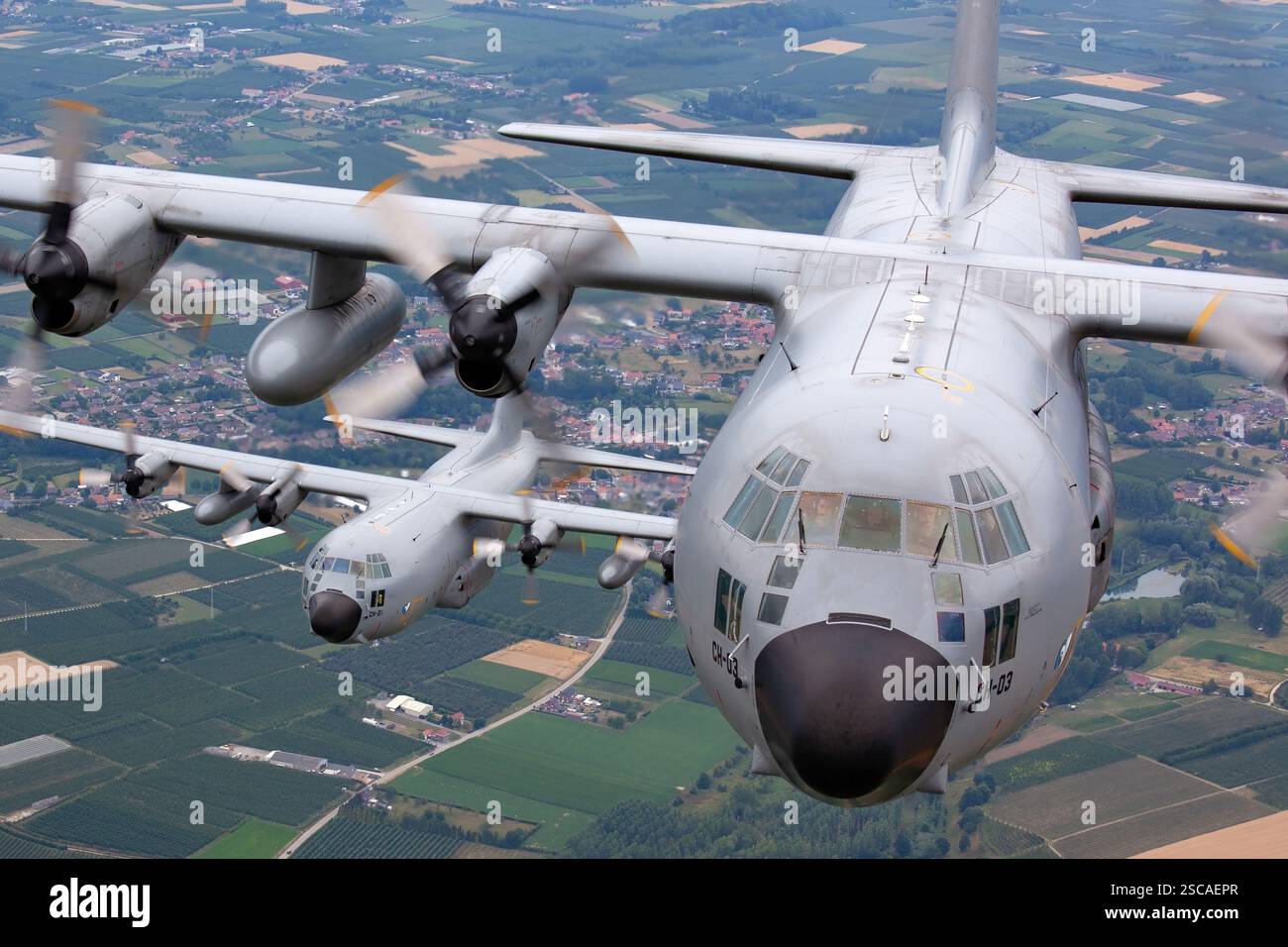 A 2-ship formation of Belgian Air Force C-130 Hercules aircraft flying ...