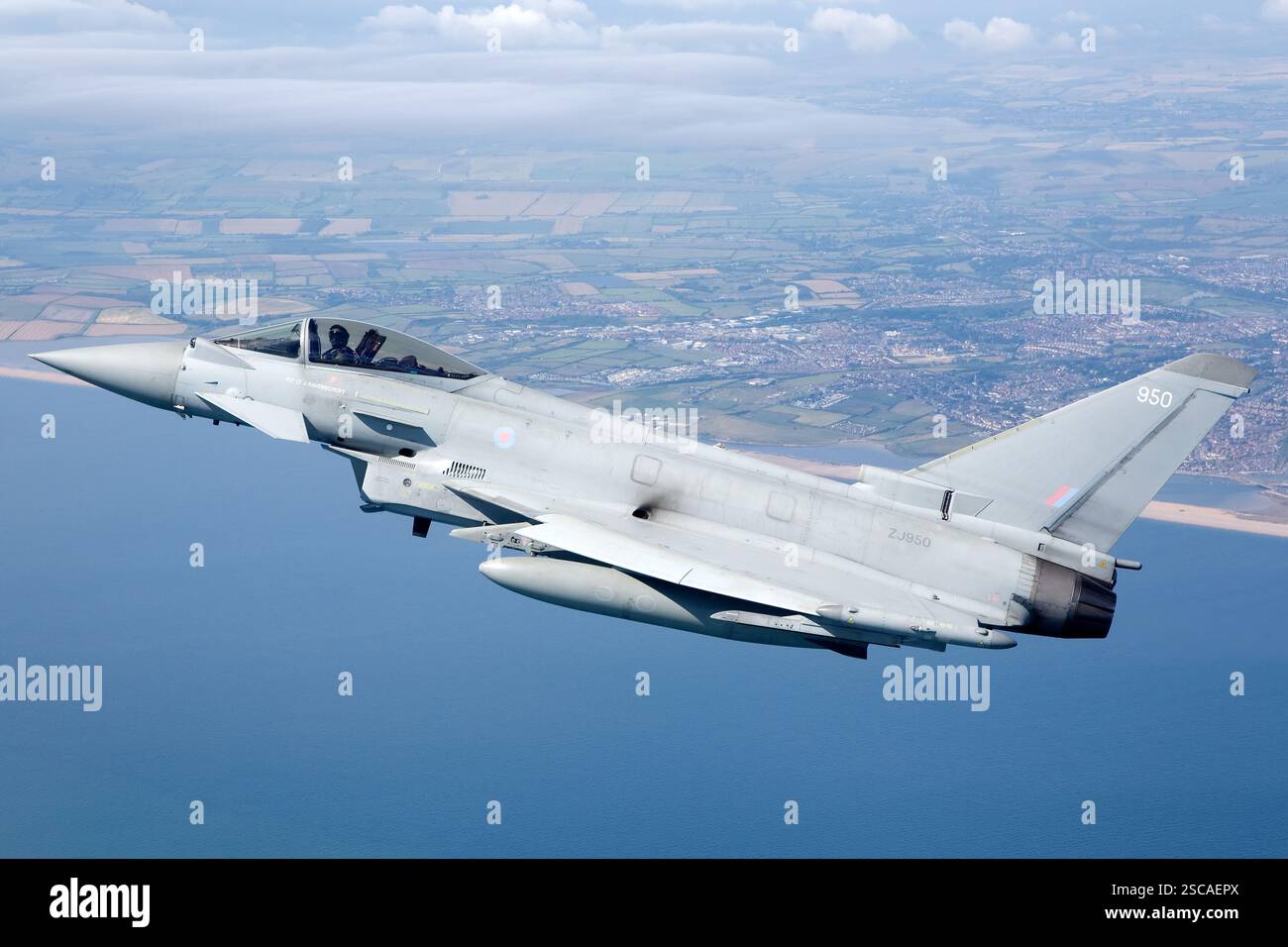 A Royal Air Force Eurofighter Typhoon in flight during an air-to-air photo shoot. The Typhoon is ...