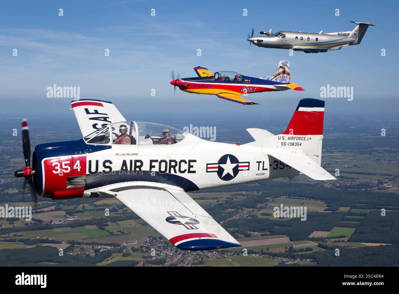 Formation flight featuring T-28, PC-7, and PC-12 aircraft in a ...