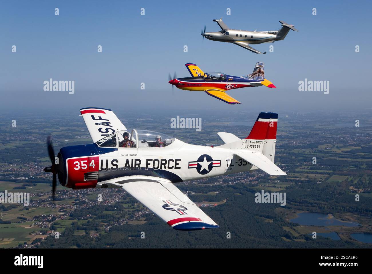 Formation flight of T-28, PC-7, and PC-12 aircraft during an air-to-air ...