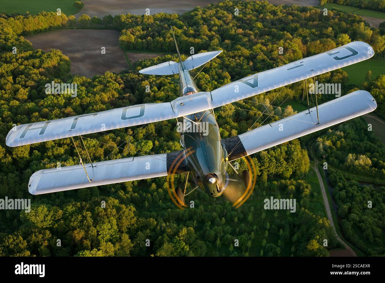 De Havilland Fox Moth flying during an air-to-air photo shoot. Powered ...