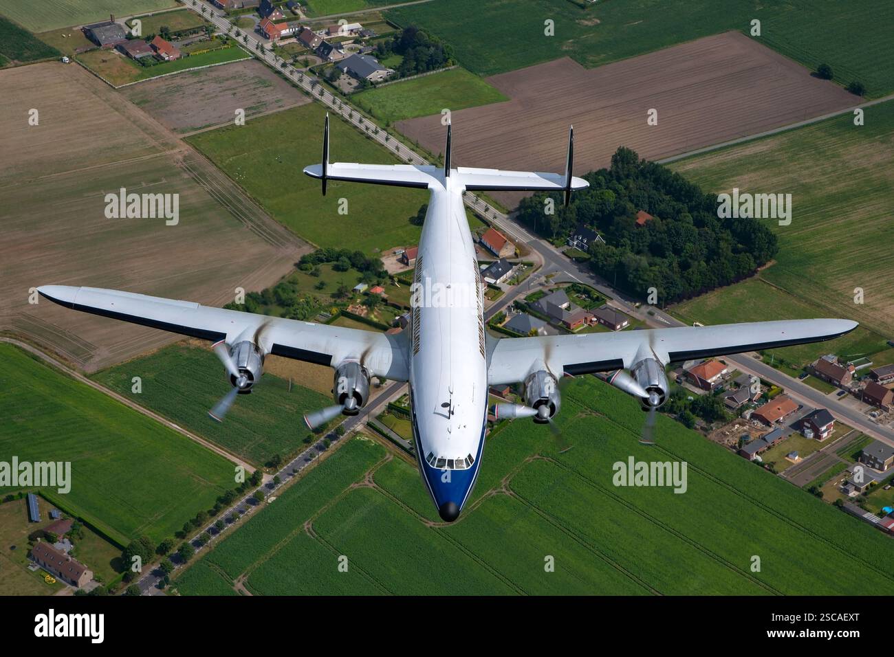 A Lockheed Super Constellation flying in perfect formation during an ...