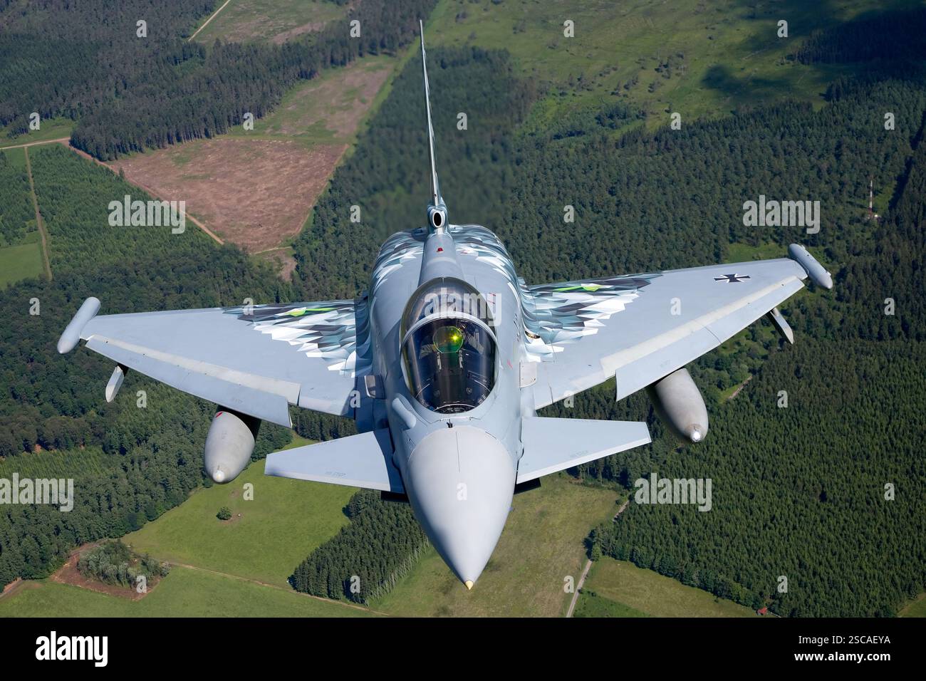 German Air Force Eurofighter Typhoon performing a steep climb during an air-to-air photo shoot ...