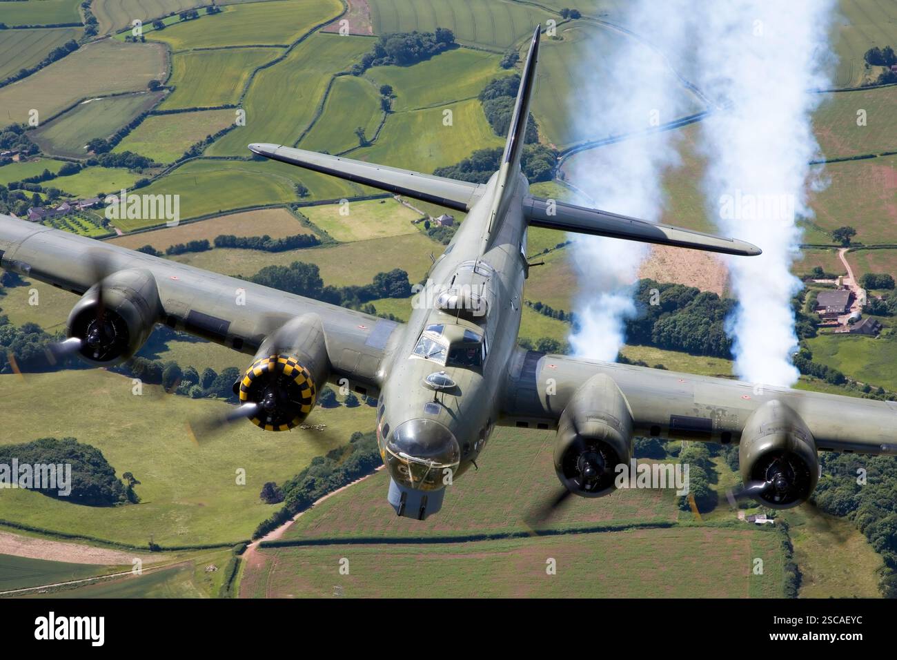 B-17 Sally B flying over the English countryside. The Boeing B-17 ...