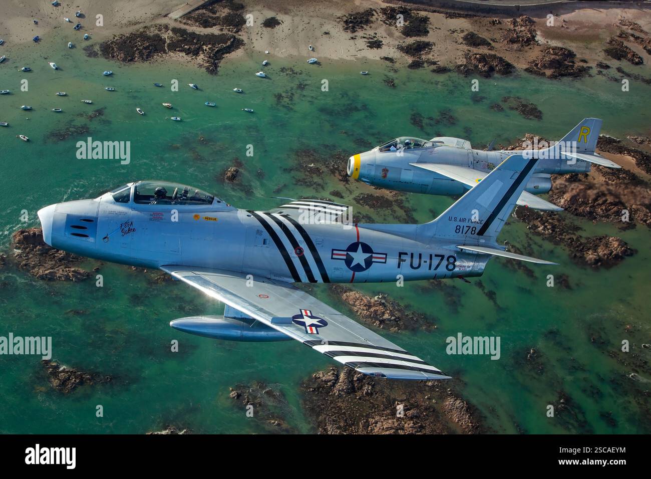 A 2-ship formation of an F-86 Sabre and Saab Tunnan flying in an air-to ...