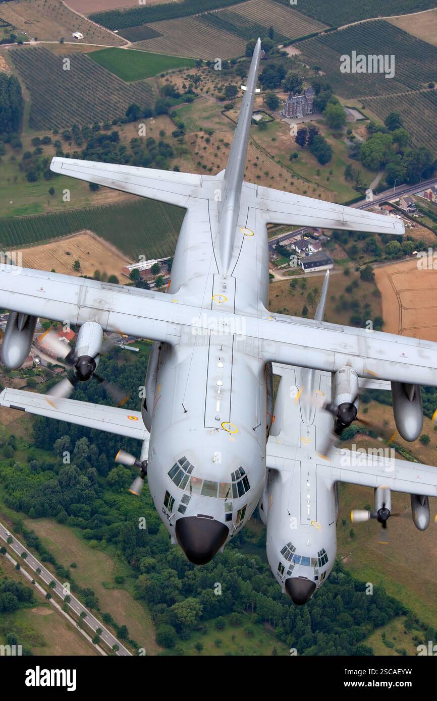A 2-ship formation of Belgian Air Force C-130 Hercules aircraft flying ...