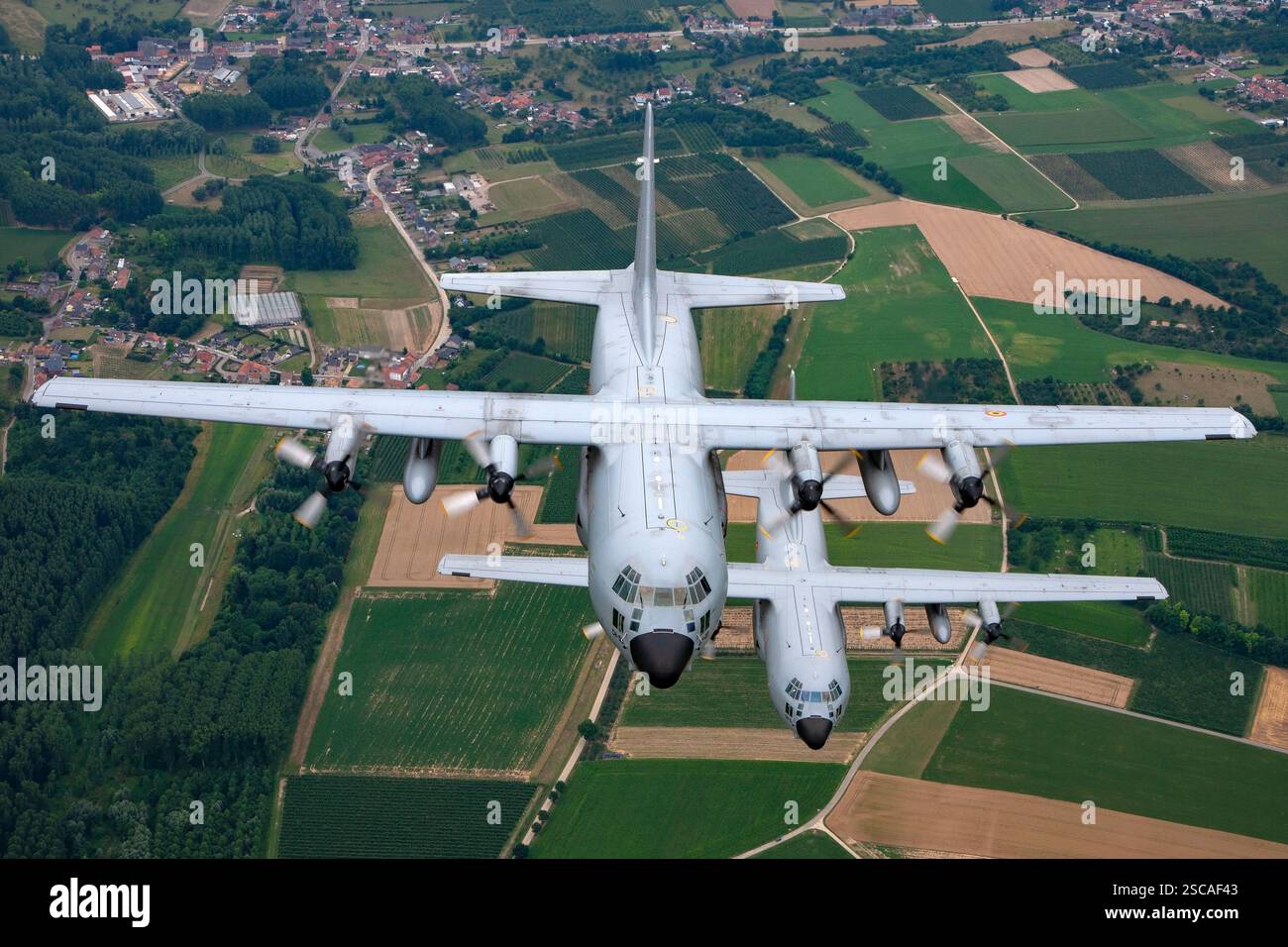 A 2-ship formation of Belgian Air Force C-130 Hercules aircraft flying ...
