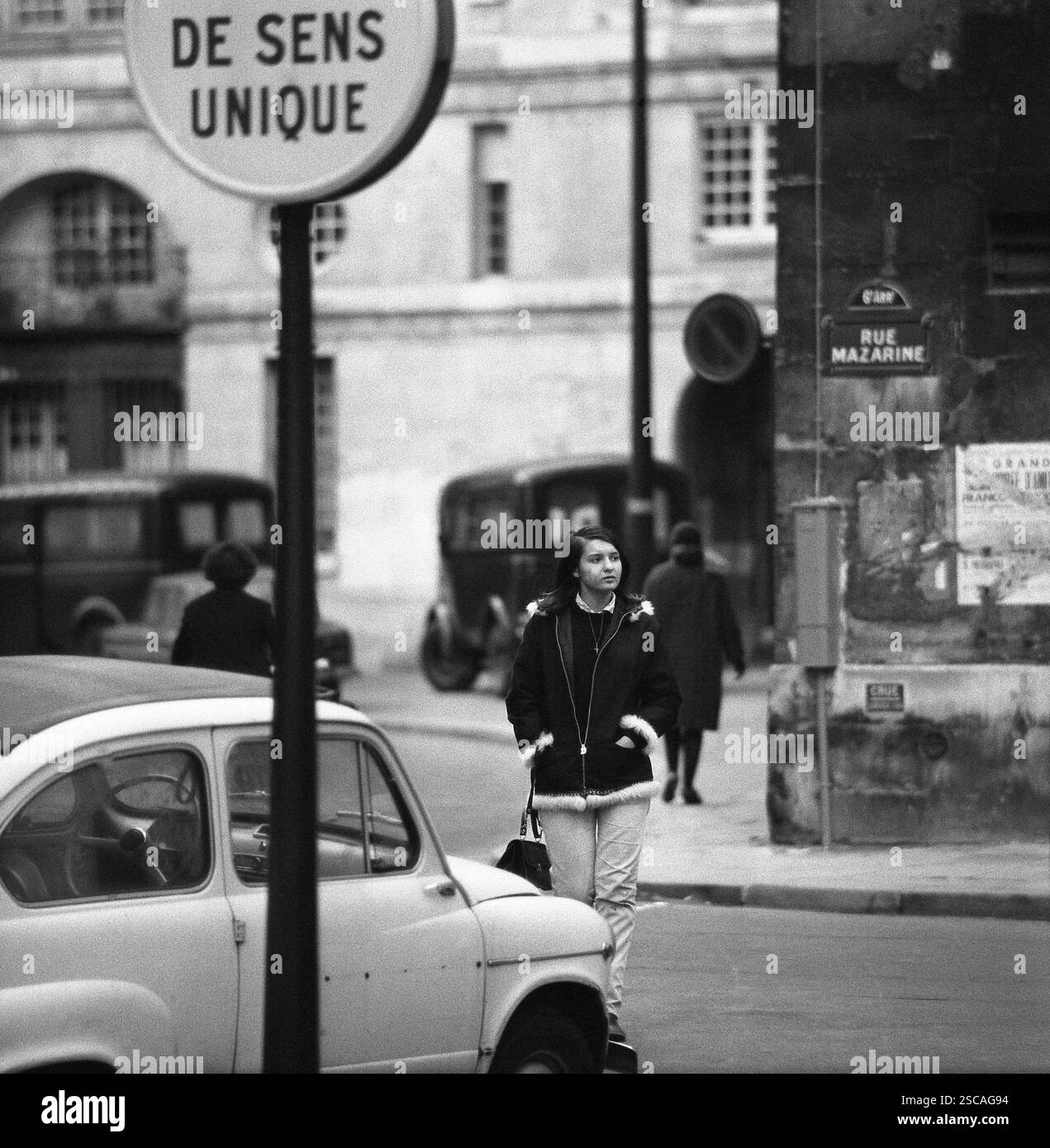 Sign (DE SENS UNIQUE), car and a woman at the Rue Mazarine at the Latin ...