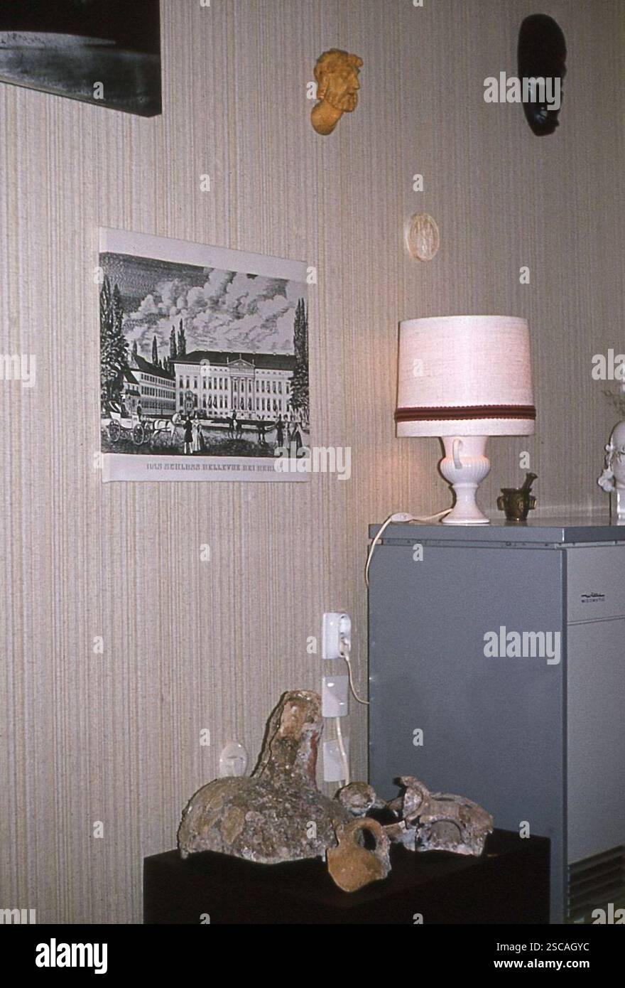 Ugly electricity night storage heater with amphorae remains in front ...