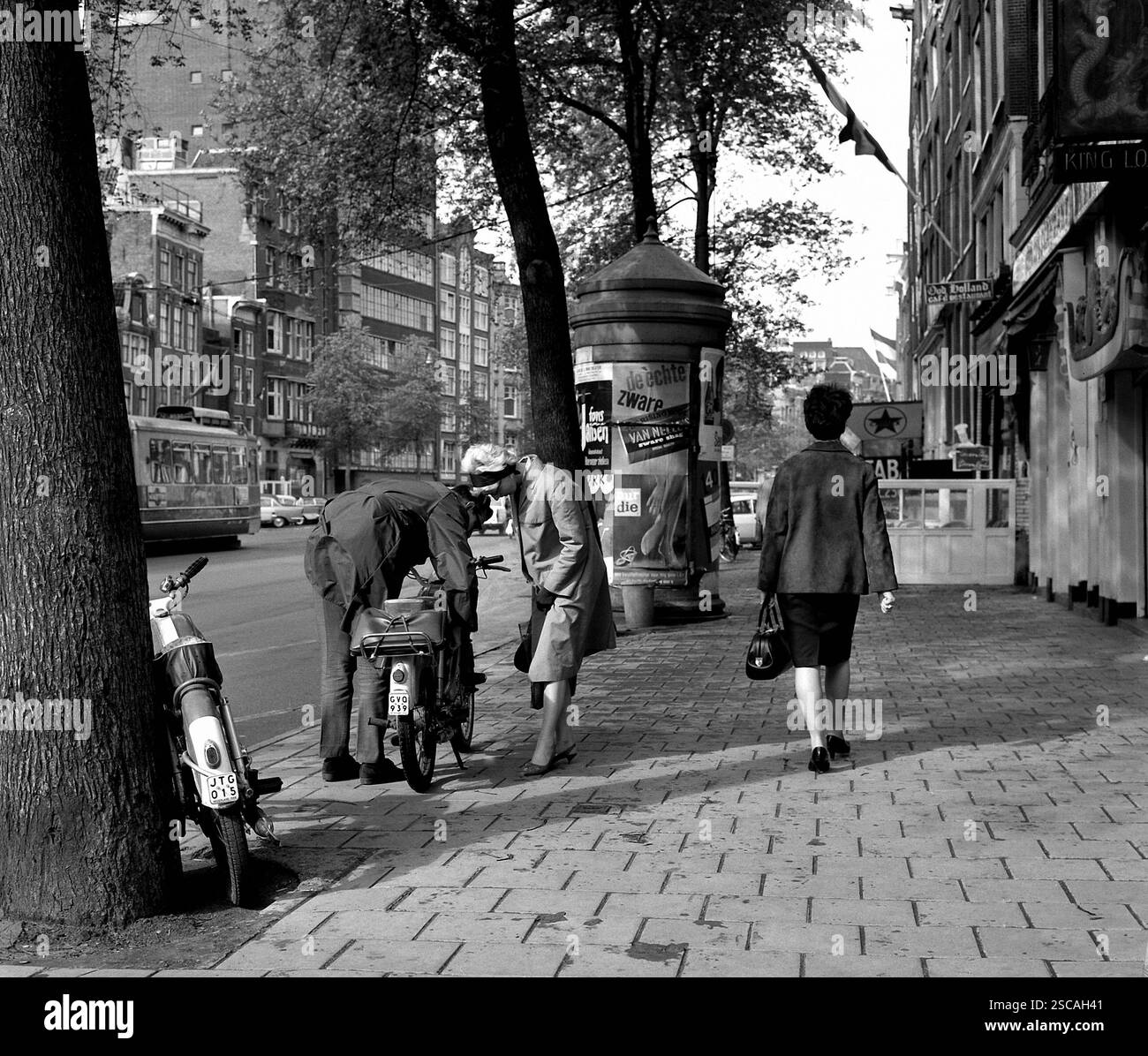Amsterdam: Picture shows couple with moped, woman with handbag and in ...