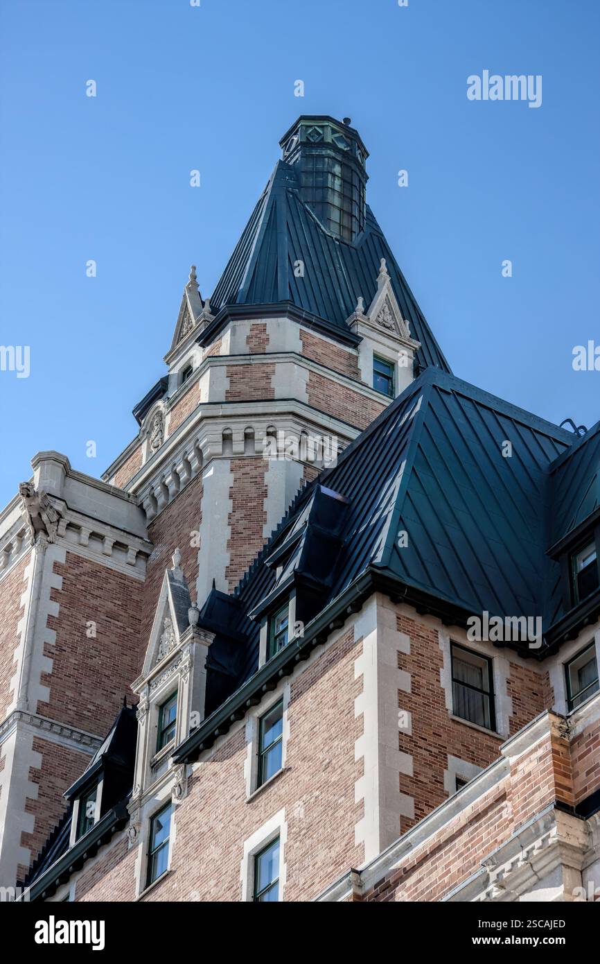 A building with a black roof and a blue cap. The roof is made of metal ...