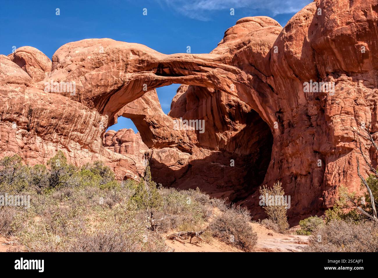 A bridge is in the middle of a desert. The bridge is made of stone ...