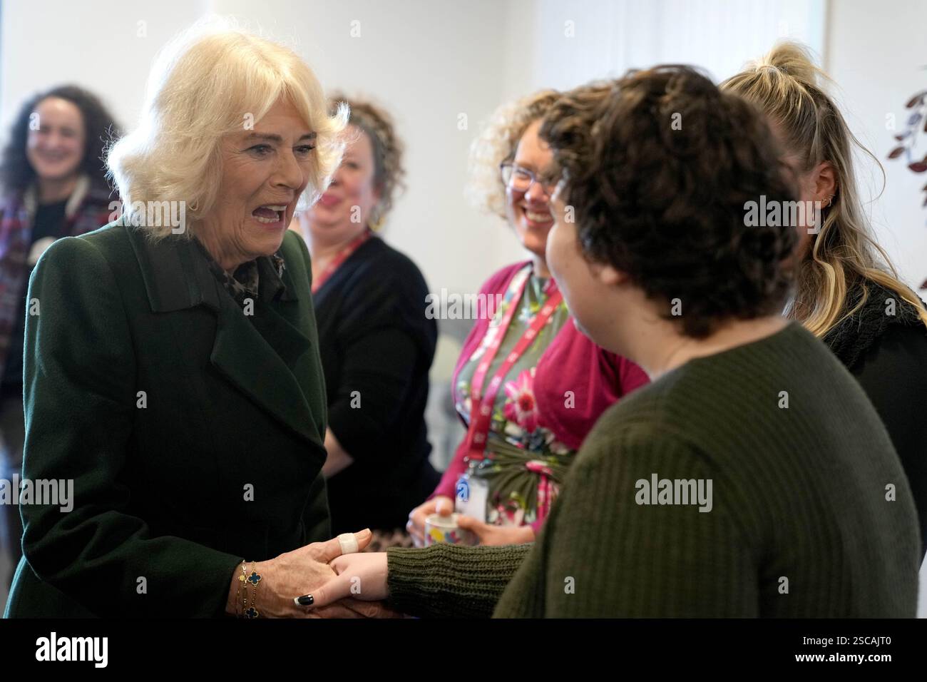 Queen Camilla speaks to staff members during a visit to CoLab Exeter, a ...