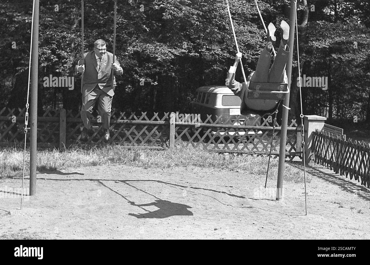 Men on a playground in Mühlheim, 1965. [automated translation] Stock ...