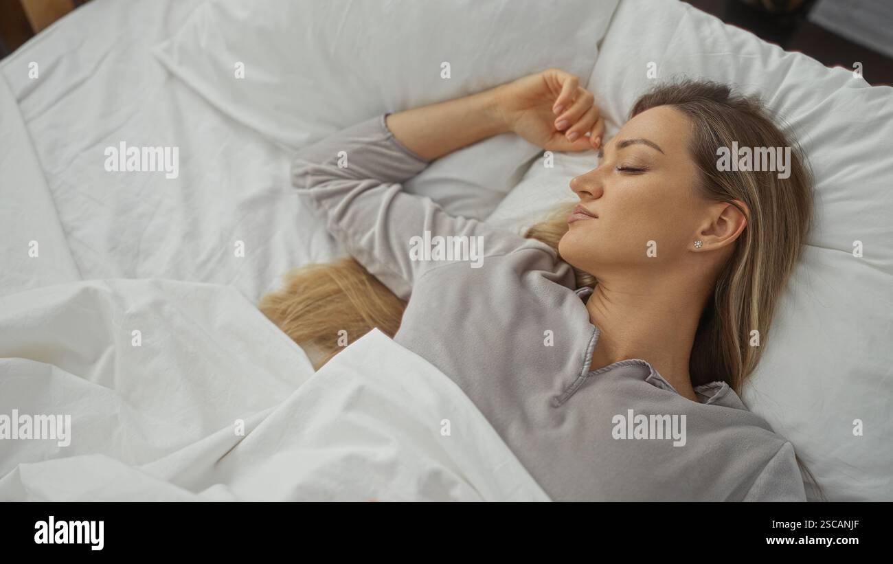 Woman relaxing peacefully in a cozy bedroom setting with a serene ...