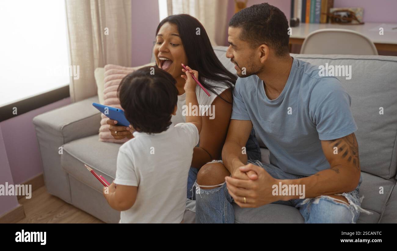 Latin family spending time together at home, with a man, woman, and ...