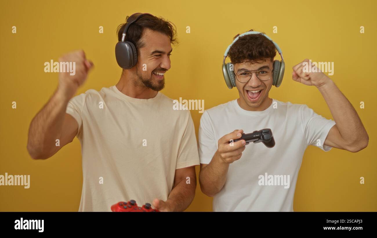 Father and son sharing a joyful moment playing video games together ...