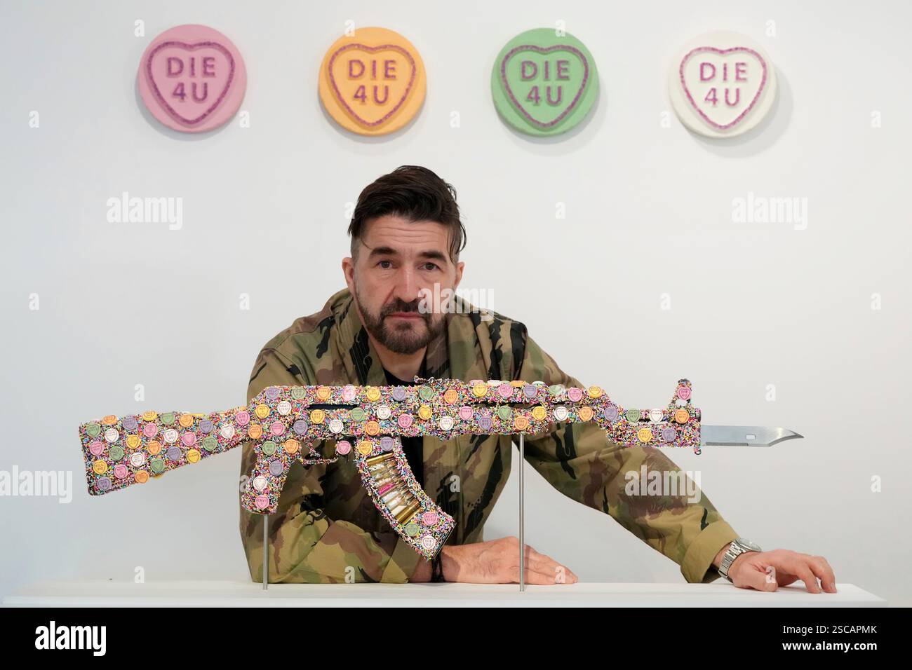 British artist and former Special Forces soldier, Bran, looks at one of ...
