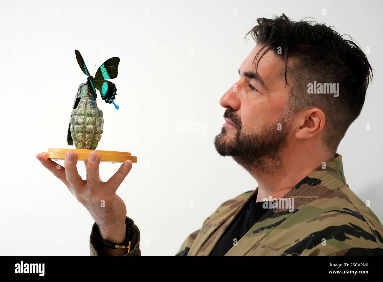 British artist and former Special Forces soldier, Bran, looks at one of ...