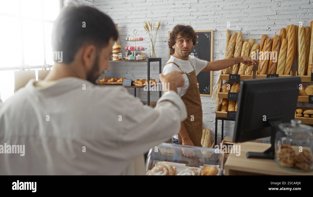 Baker and customer talking in bakery shop interior with bread display ...