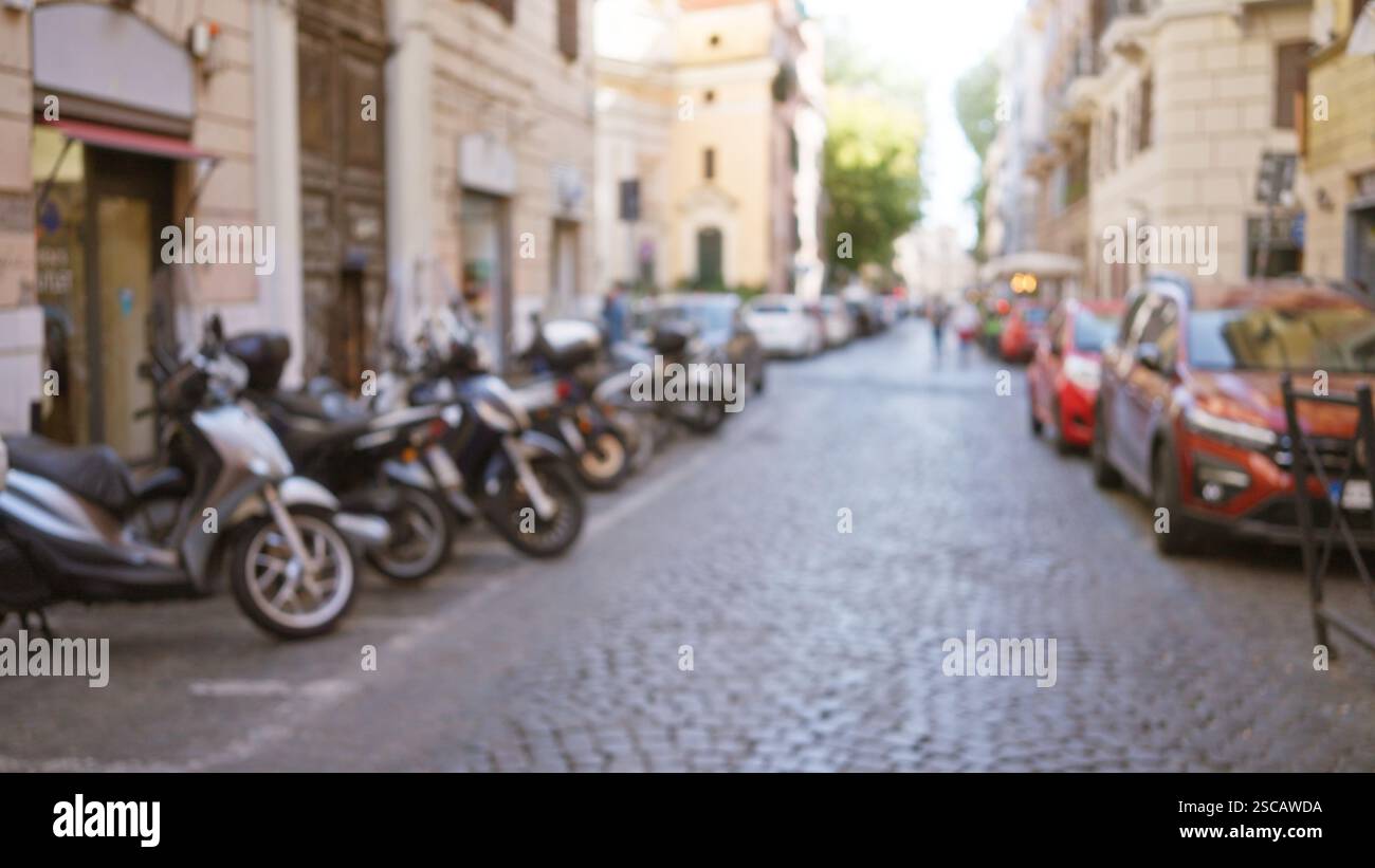 Blurred street scene in rome, italy, capturing defocused view of ...