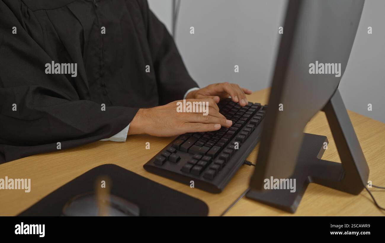 Judge typing on a keyboard in an office, focusing on the hands and ...