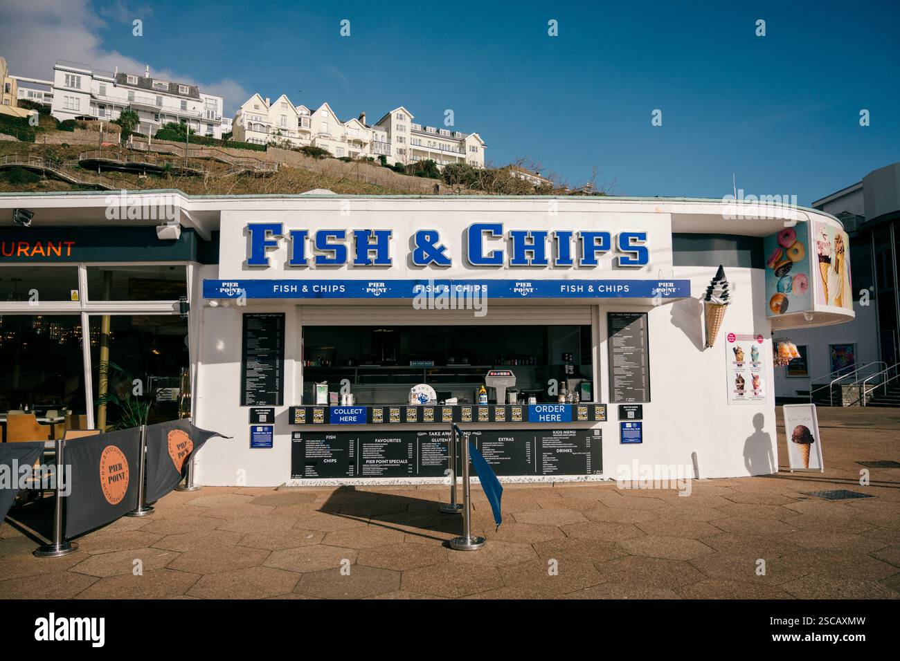 A traditional seasode fisdh and chip shop on the promenade at Torquay ...