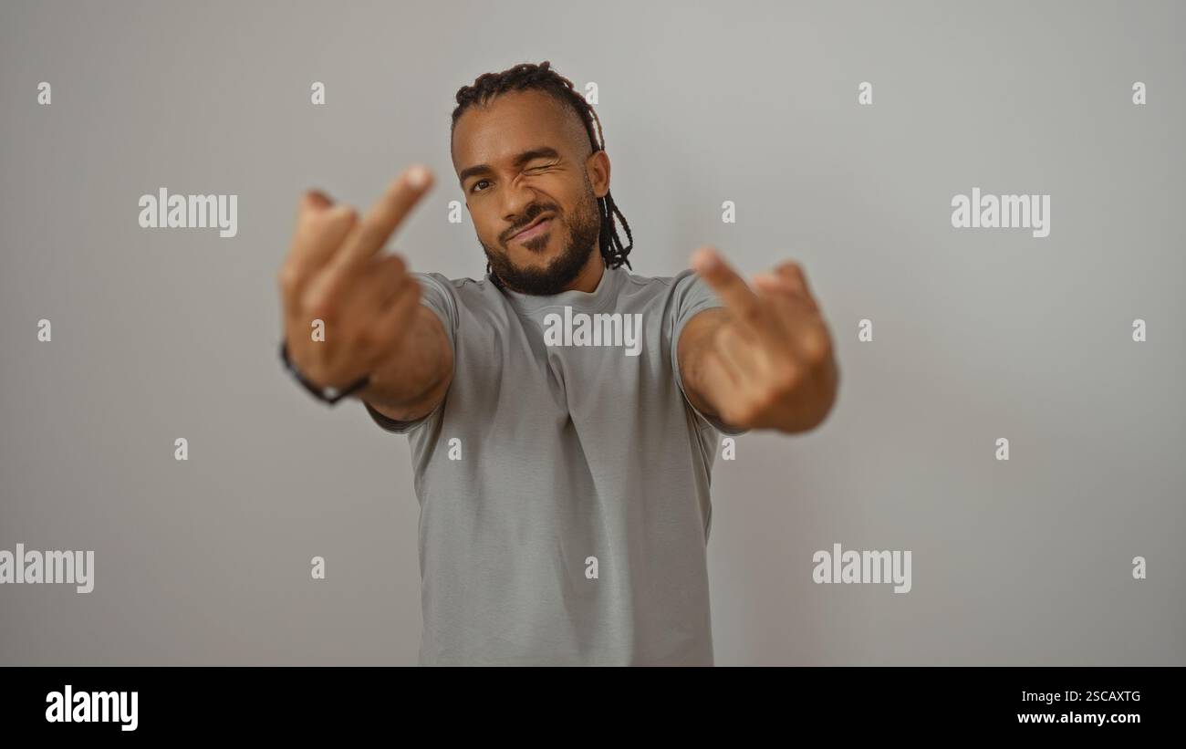 Handsome young man with braids making an expressive gesture over ...