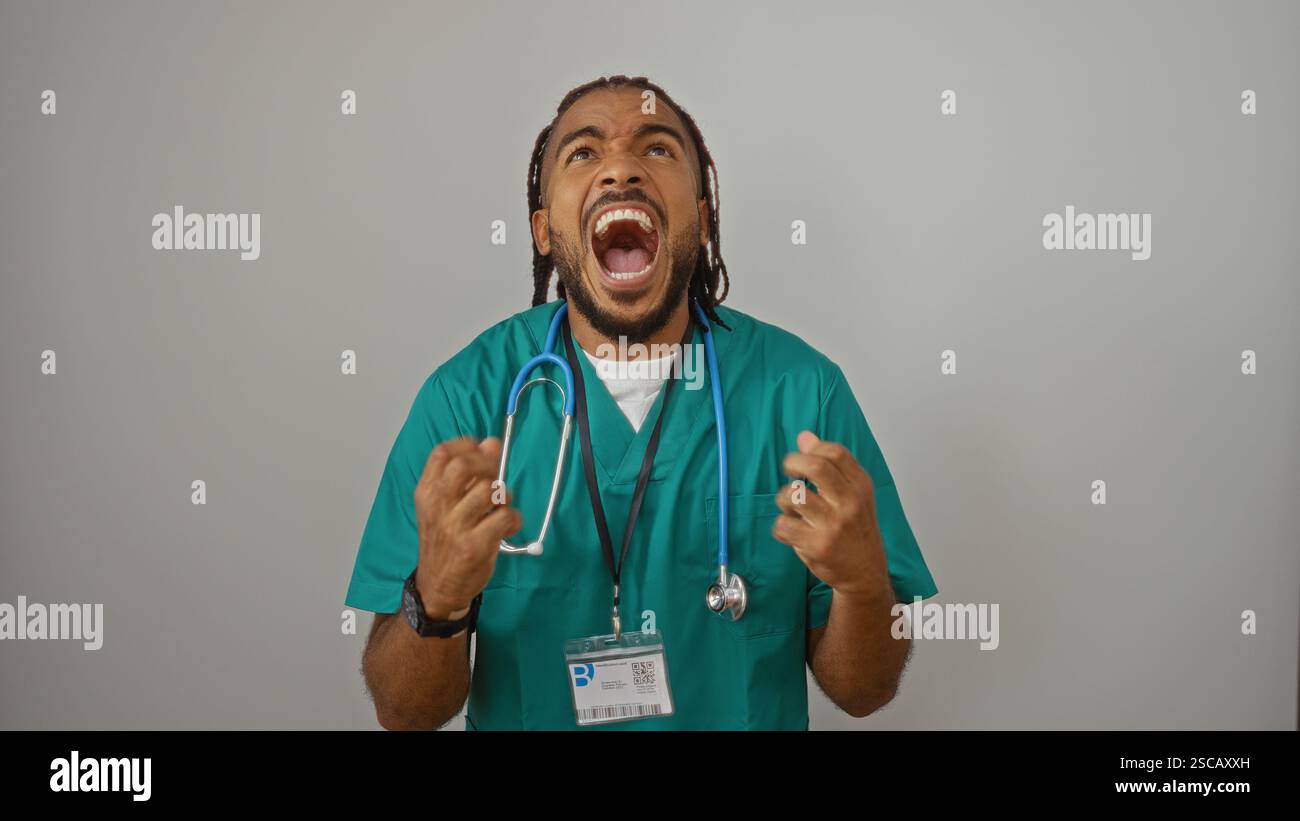 Frustrated man in green scrubs with stethoscope over white background ...
