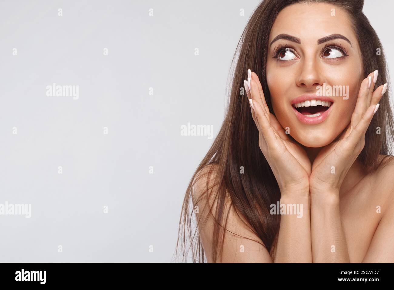 Shocked and surprised girl laughing covering mouth her hands.Beautiful ...