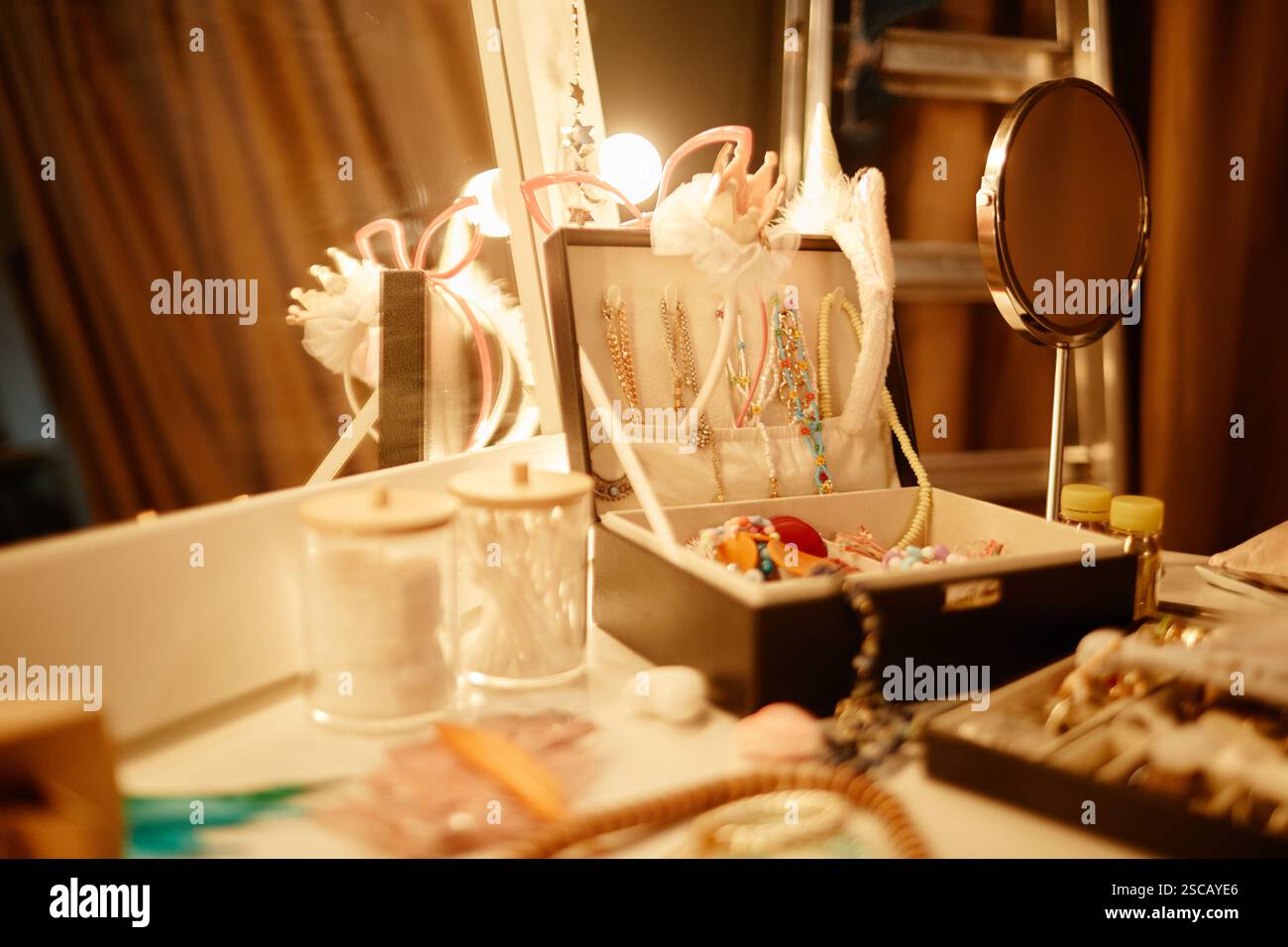 Assorted jewelry and hair accessories meticulously arranged on dressing ...
