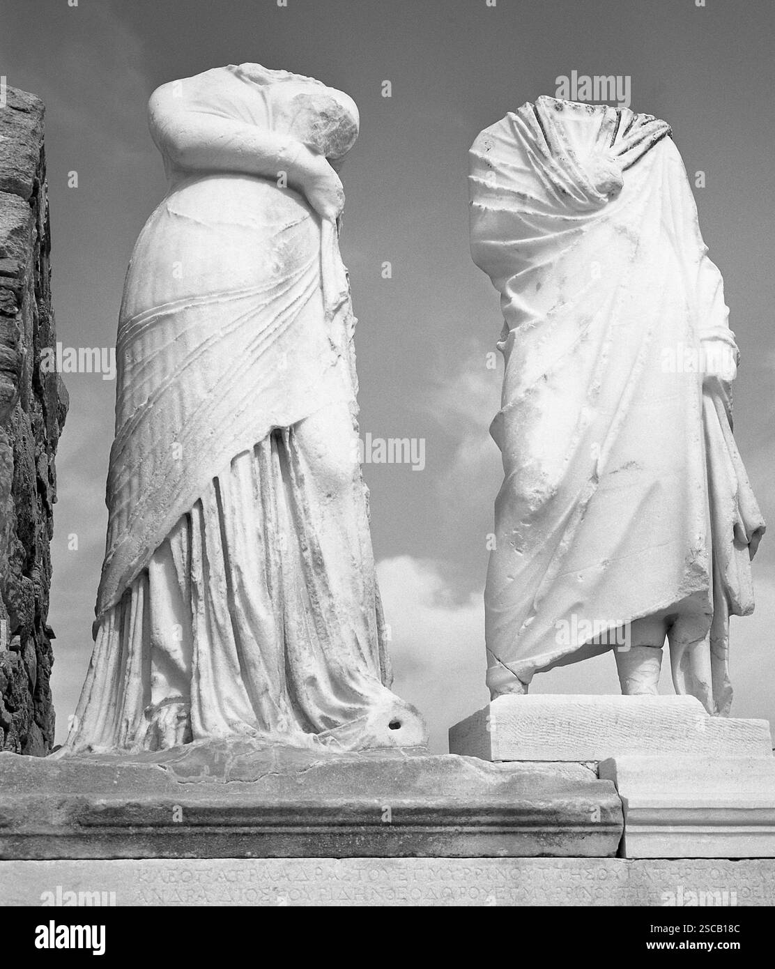 Ancient statues without head in Delos Stock Photo - Alamy