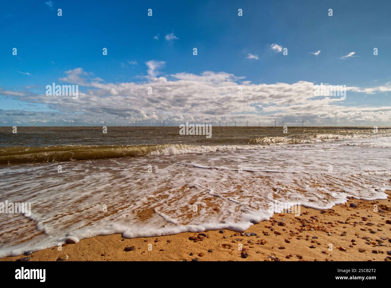 Tide comes in on caister beach Stock Photo - Alamy