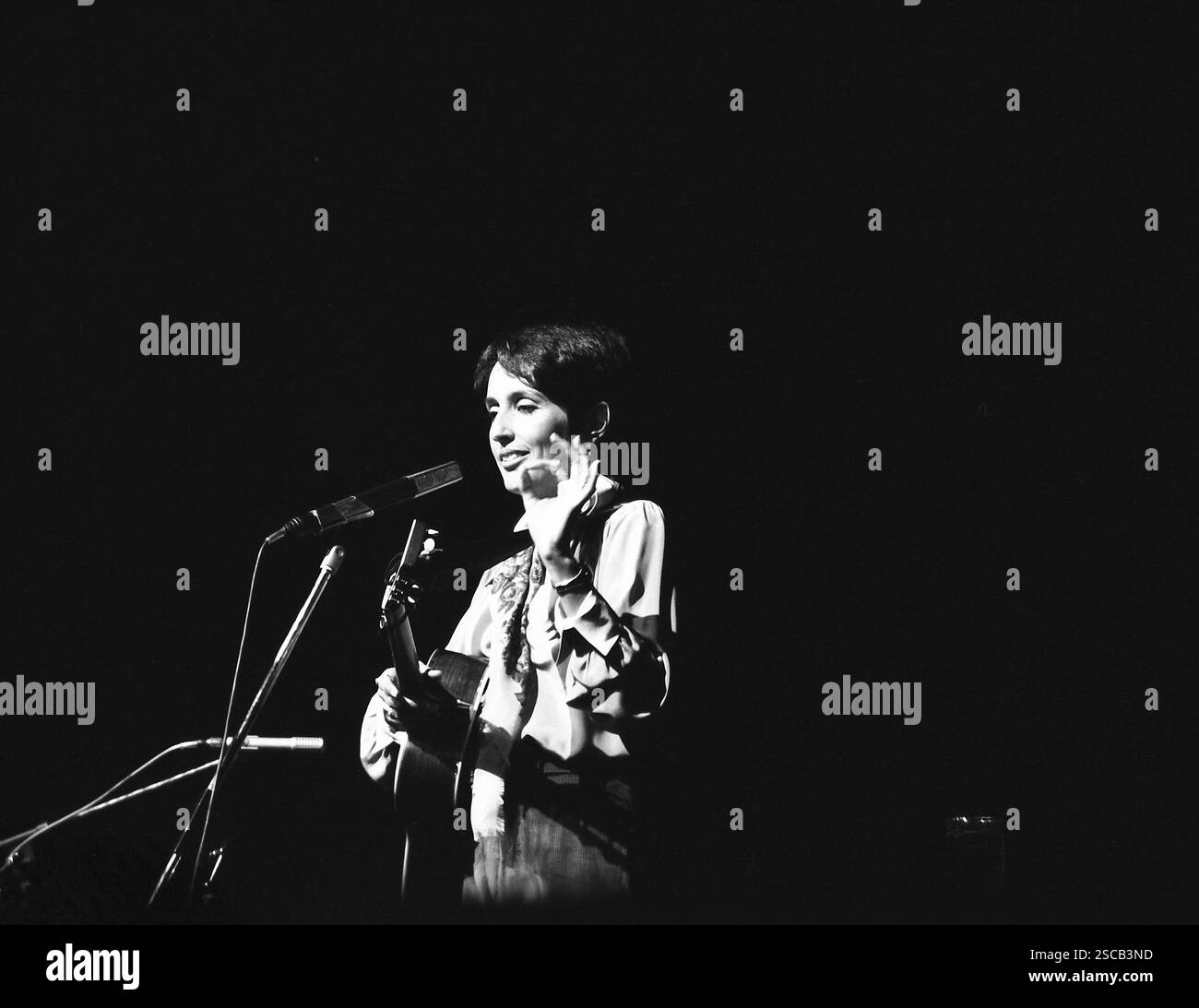American folk singer Joan Baez at a concert at the Deutschlandhalle in ...