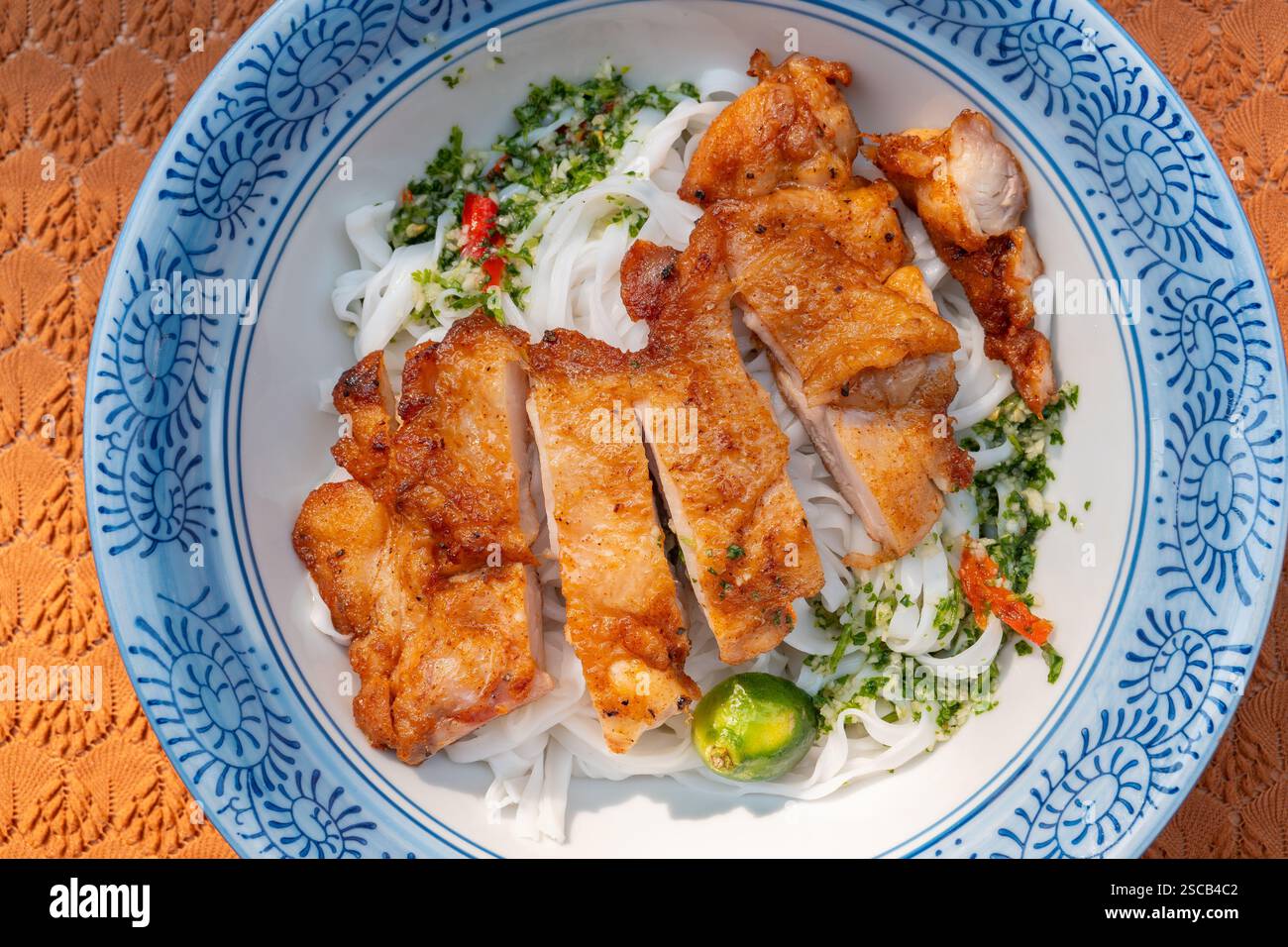 top view Thai-style chicken with stir-fried Ho Fun or rice noodles at ...