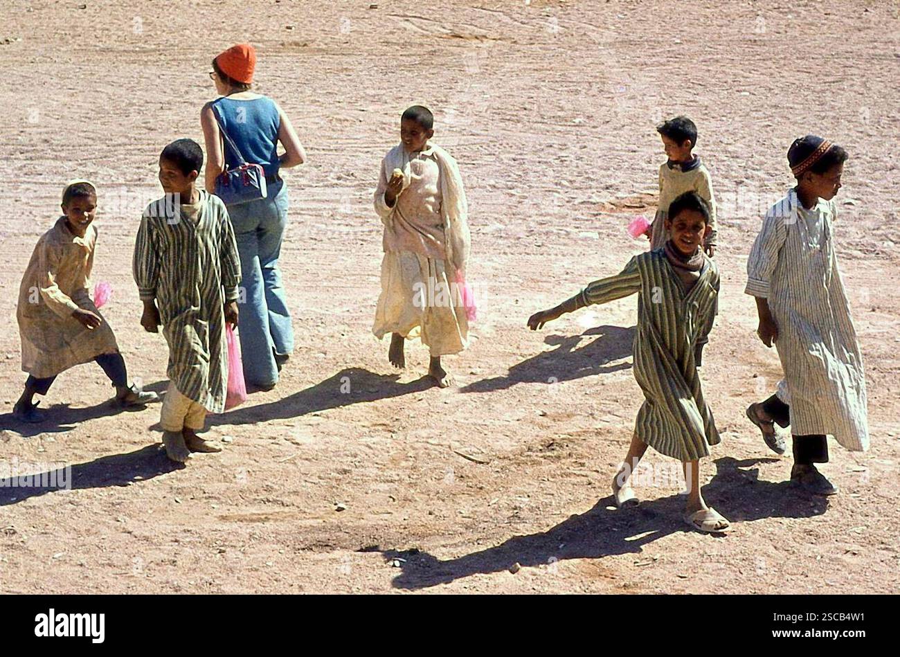 Arab children playing in Israel. They wear the traditional Thawb ...