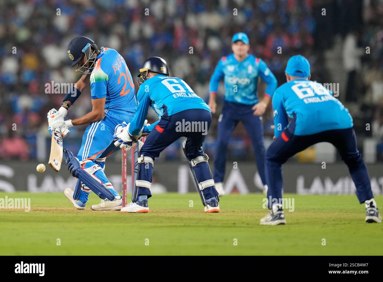 India's Axar Patel, left, plays a shot during the first one day ...