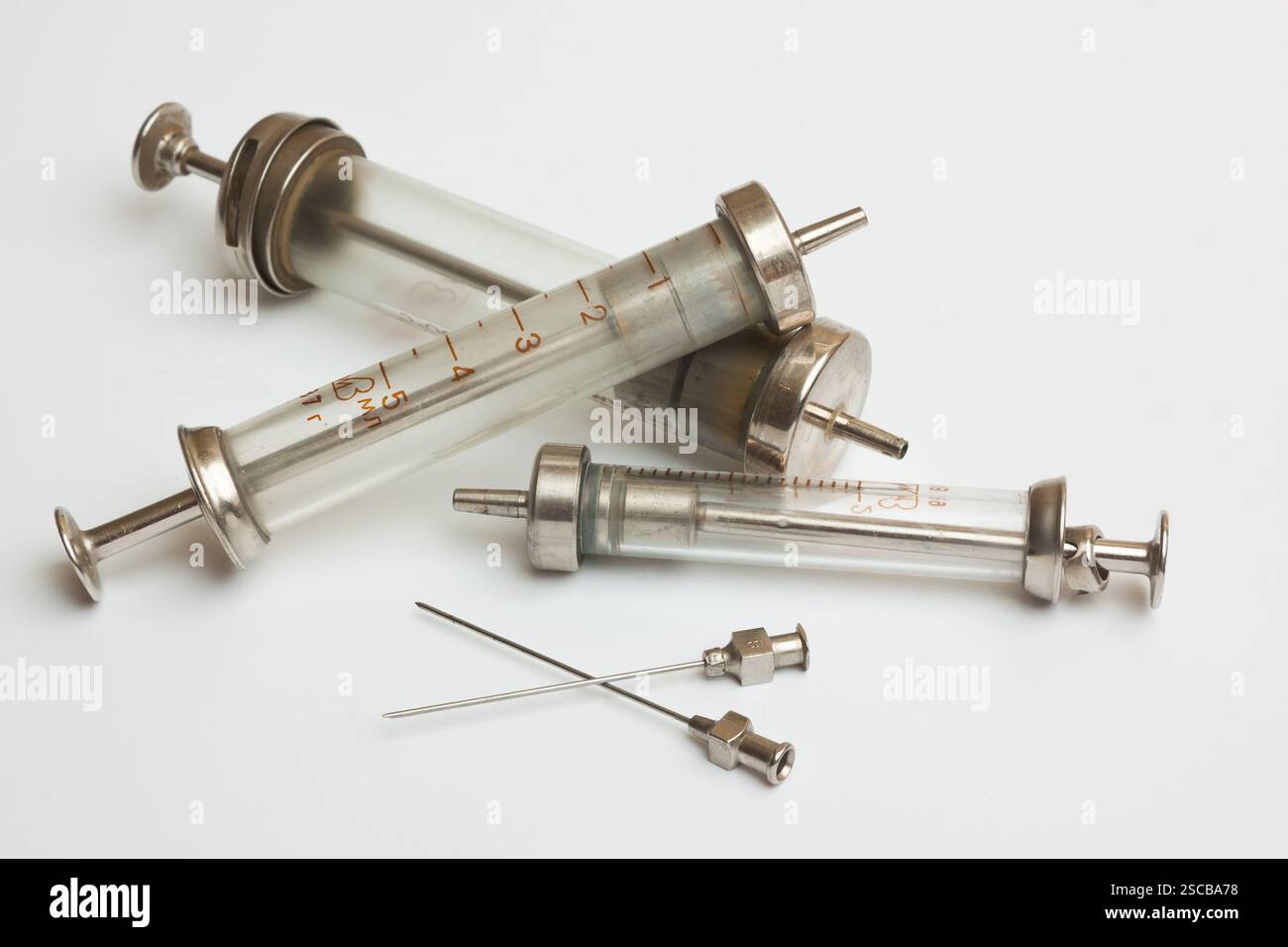 syringes old model on a white background Stock Photo - Alamy