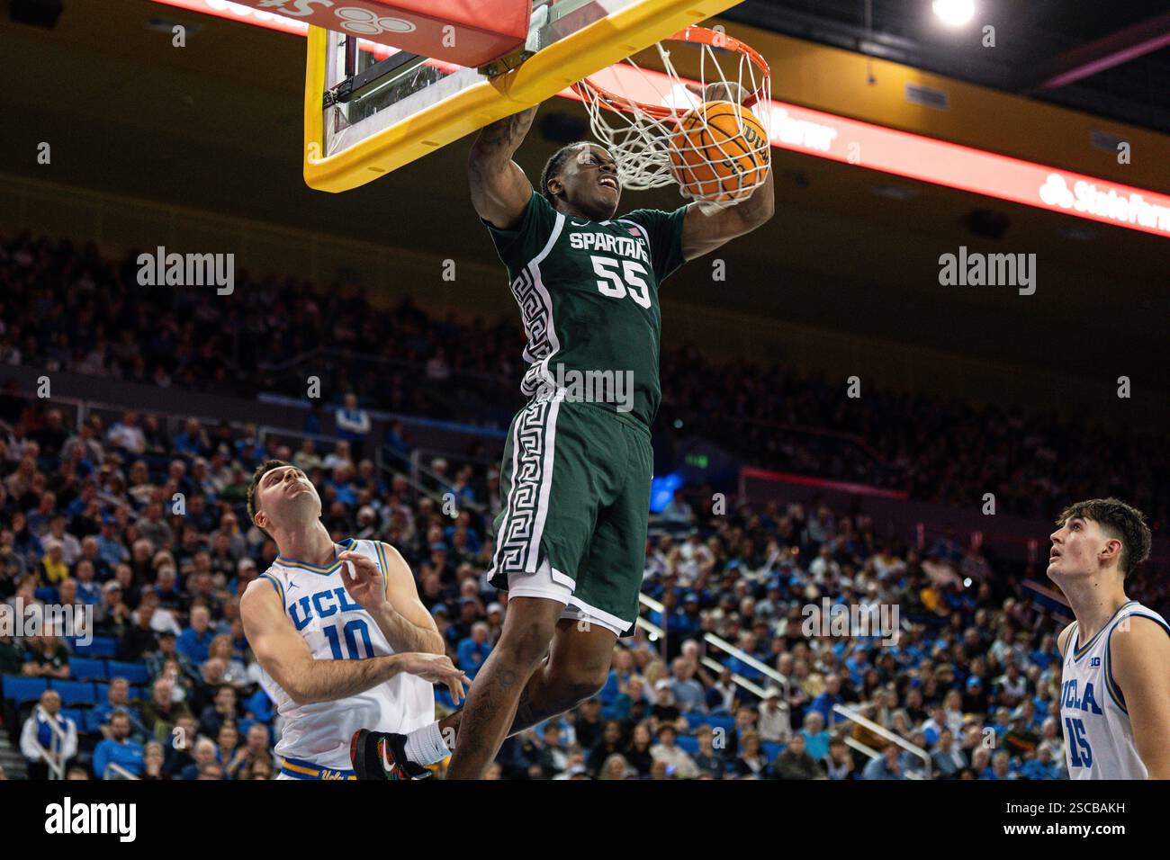 Michigan State Spartans forward Coen Carr (55) dunks during a NCAA men ...