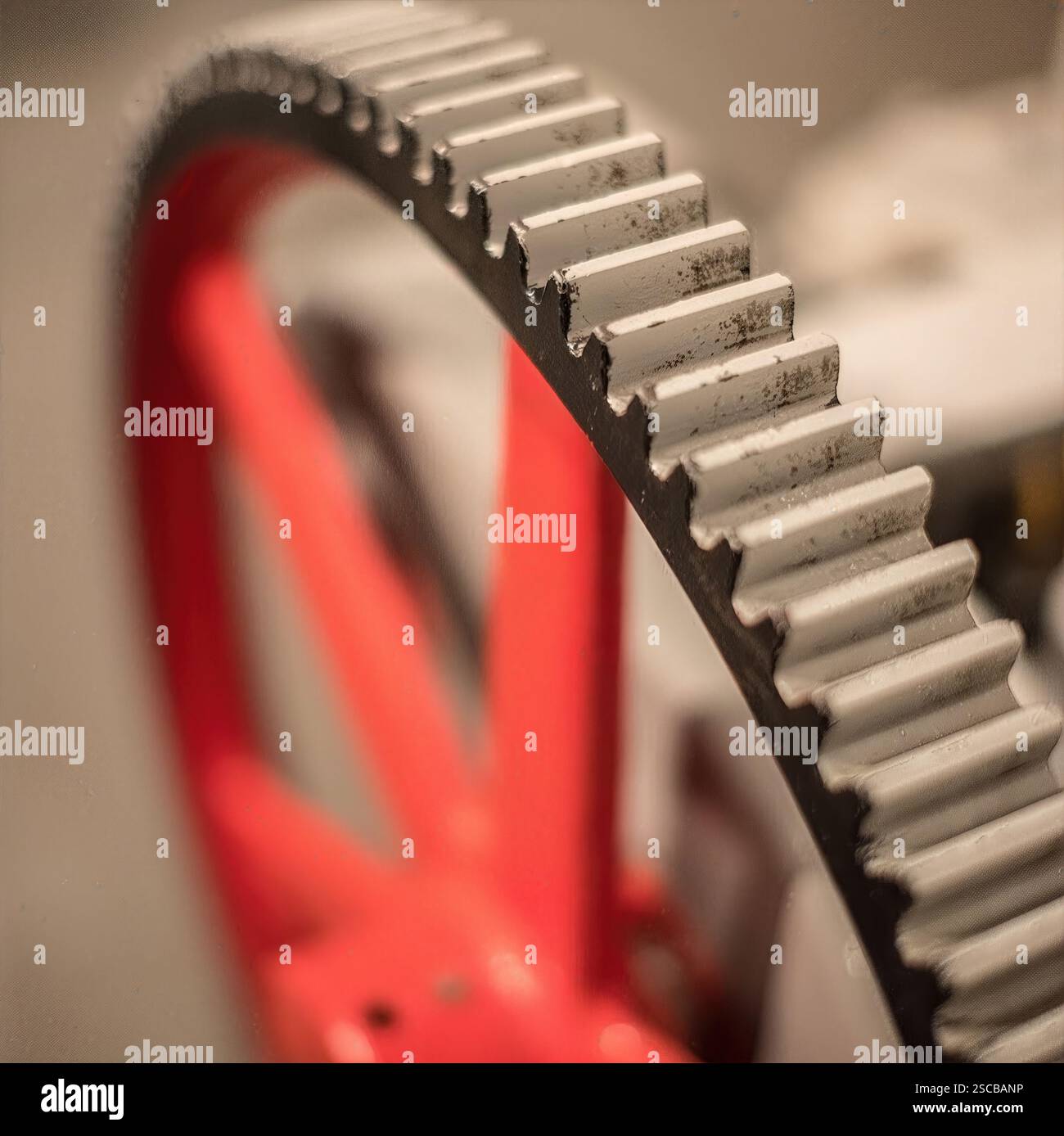 Gear Wheel Macro: Close-up view of a red gear wheel with white teeth ...