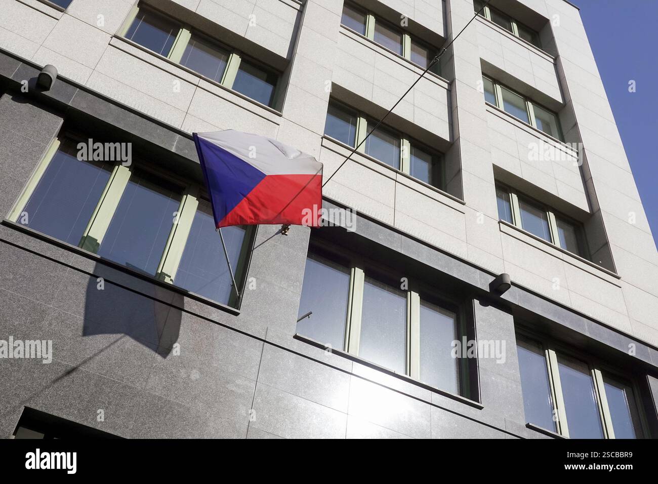 Czech national flag waving on modern building, shadow on marble wall ...