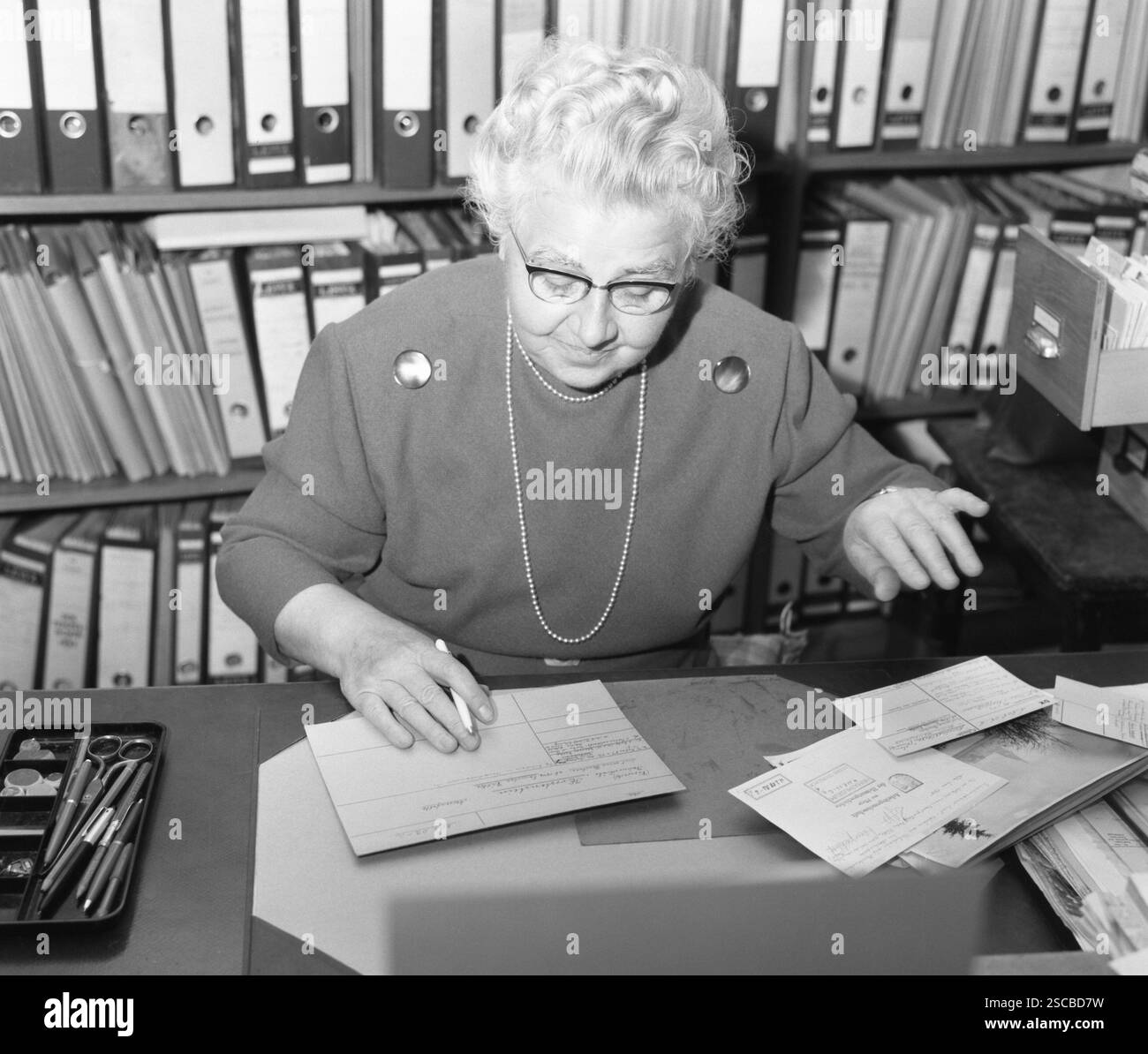 Miss Mueller at the local museum in Berlin-Tempelhof with documents ...