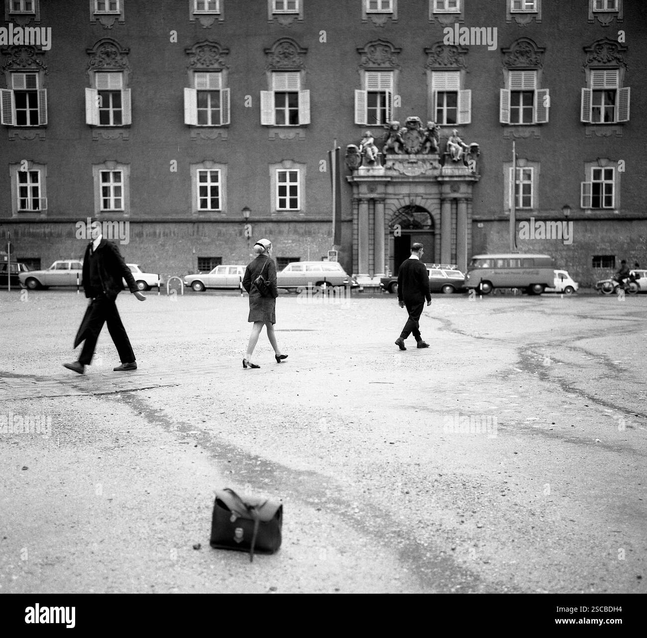 Passersby and a lonely bag at the Residenzplatz in Salzburg Stock Photo ...