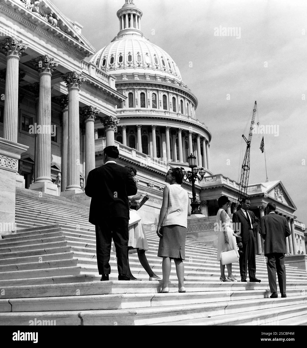 Stairs in front of the Capitol Building in Washington. Some people are ...