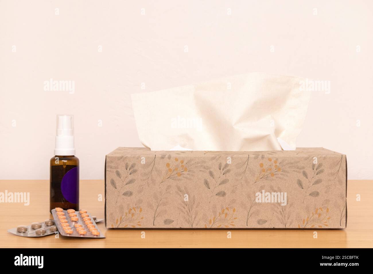 A box of tissues, a stack of pills and a spray Stock Photo - Alamy