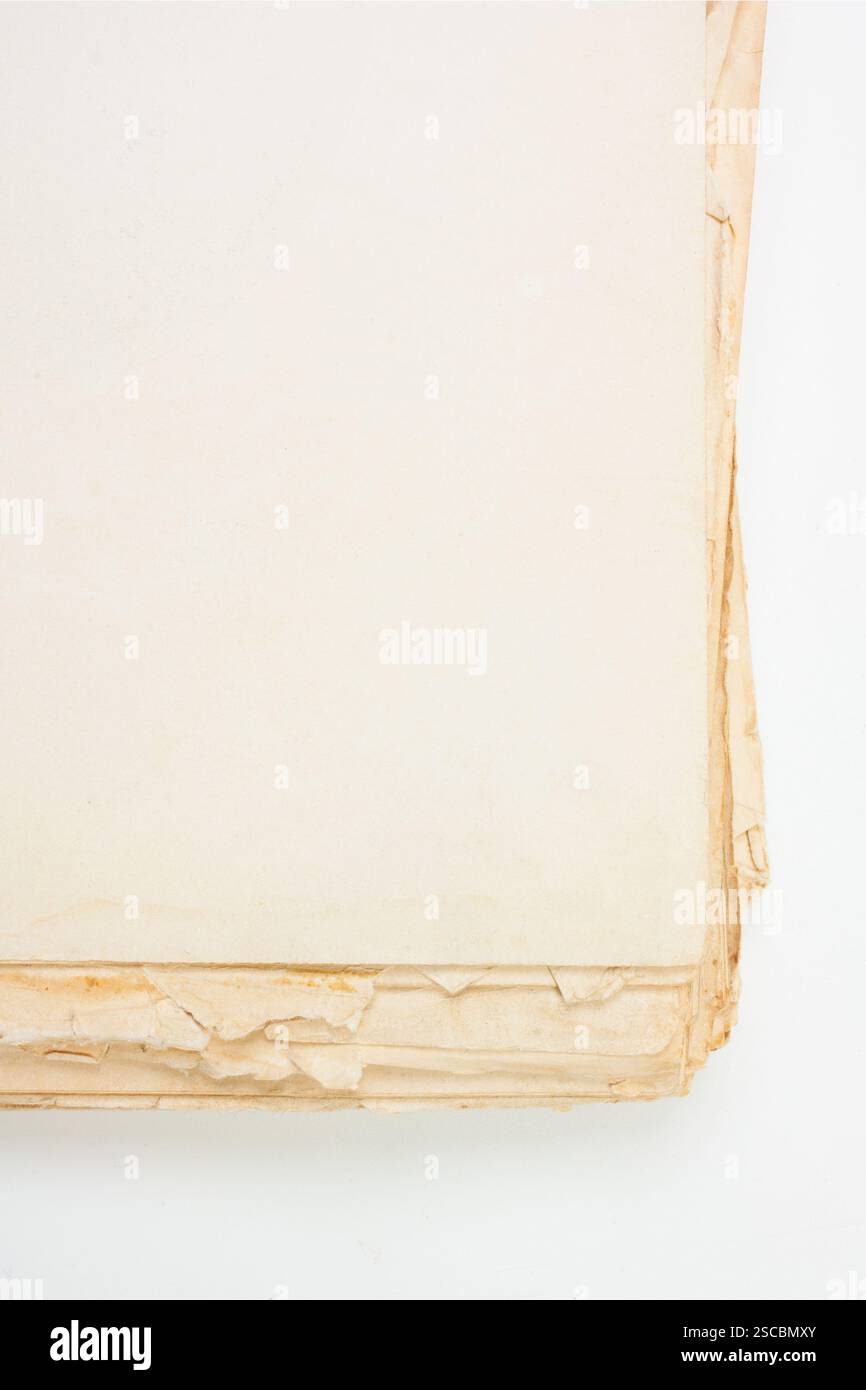 An old book with a crumpled sheet and hardcover on white background ...