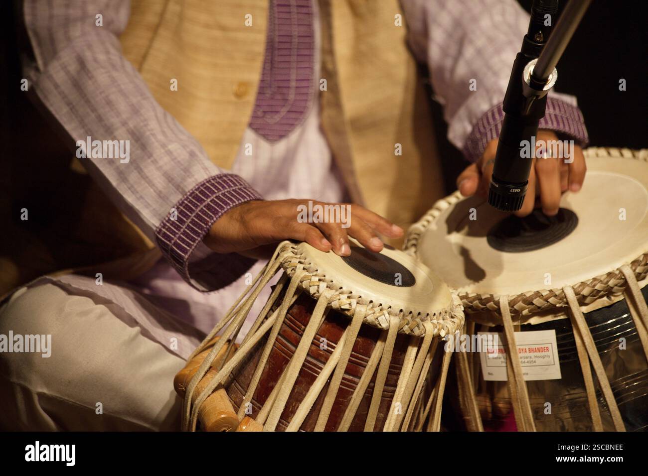 Someone playing on Indian drums called tabla Stock Photo - Alamy