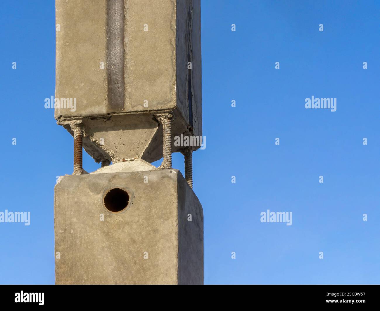 Fragment of a reinforced concrete column of square section with ...