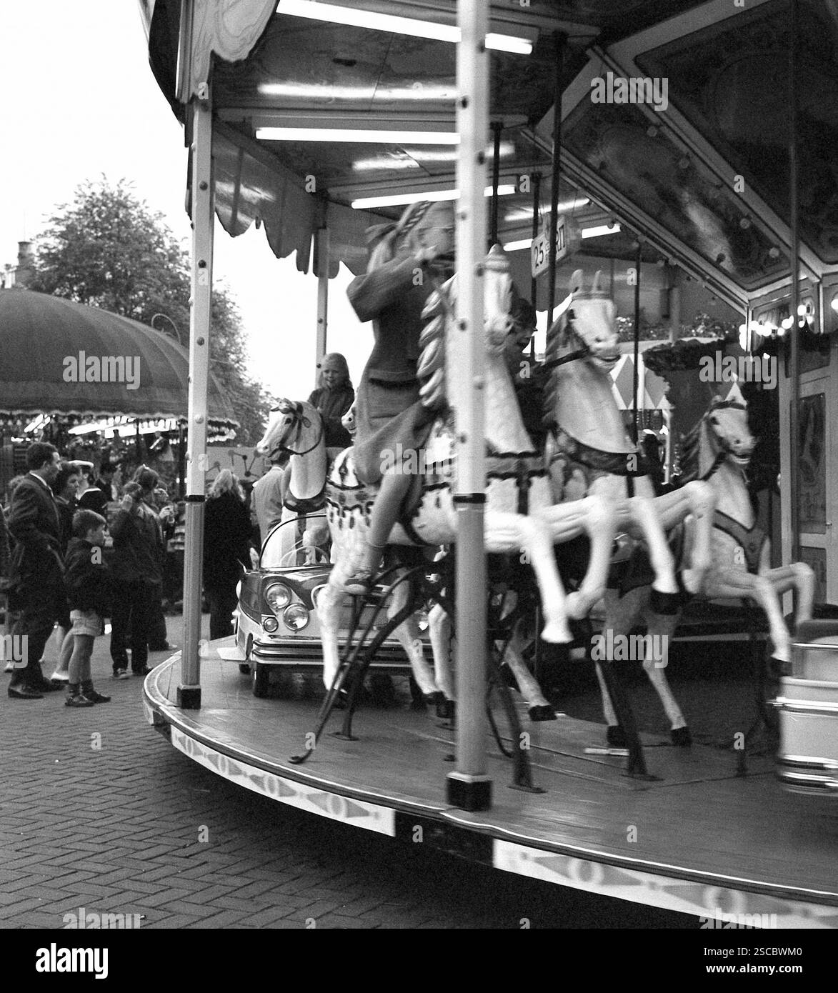 Children on a fair in Amsterdam. Picture shows children on a carousel ...
