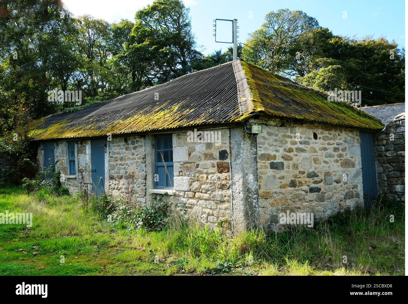 An old barn with a wi fi booster aerial mounted on the roof - John ...